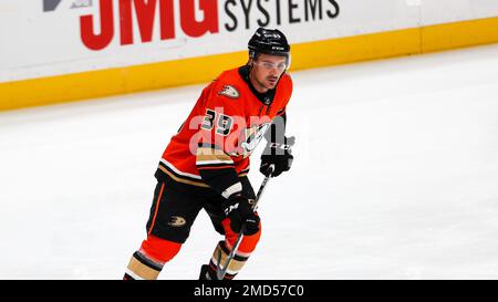 Anaheim Ducks forward Sam Carrick, center, and San Jose Sharks ...
