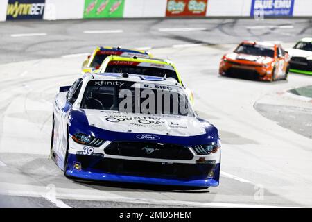 Driver Ryan Sieg (39) leads driver Austin Hill (21) into turn two ...