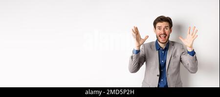 Businessman scream and shake hands in panic, look alarmed and anxious ...