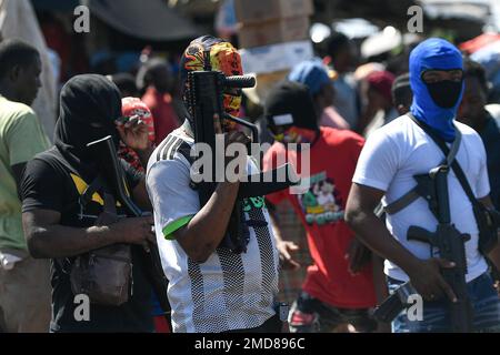 Members of the "G9 and Family" gang hold weapons as the group marches ...