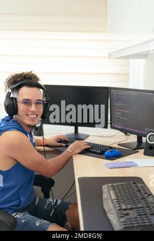 Male programmer working at table in office Stock Photo - Alamy
