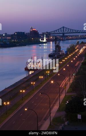 View of Pierre-Dupuy Avenue and Jacques Cartier bridge at dusk, Port of ...
