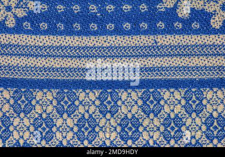 A fragment of the texture of a white-blue tablecloth made in the 1960s ...