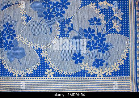 A fragment of the texture of a white-blue tablecloth made in the 1960s ...