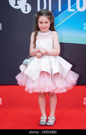 Ellie Blake poses for photographers upon arrival at the premiere of the film 'The Lost Daughter ...