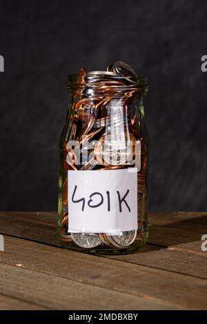 401k savings jar on a dark background Stock Photo - Alamy