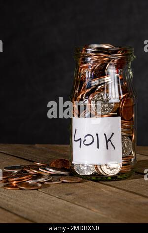 401k savings jar on a dark background Stock Photo - Alamy