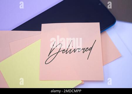 Delivered. Text on adhesive note paper. Event, celebration reminder ...