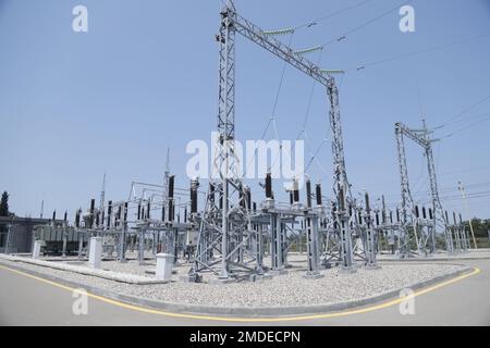 An aerial view of electrical substation surrounded by metal towers ...
