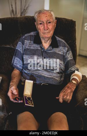 Richard Russell, a World War II Marine veteran, poses for a photo ...