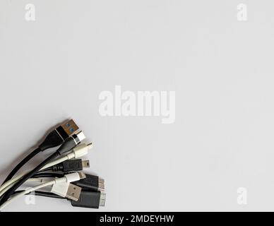 Mixed types of charging cables isolated on white background Stock Photo ...