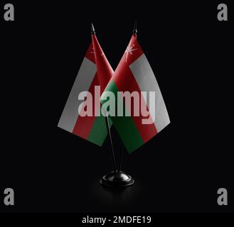 Small national flags of the Oman on a black background Stock Photo - Alamy
