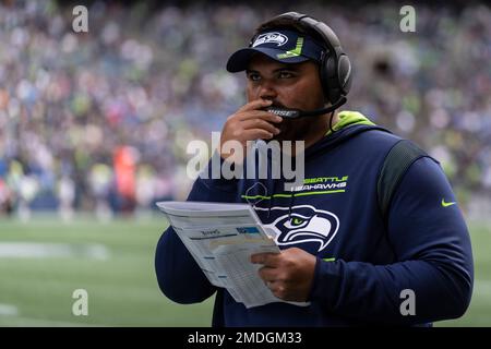 Assistant offensive line coach Keli'i Kekuewa talks with Seattle ...