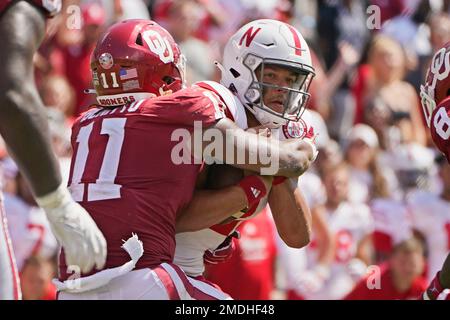 Nebraska quarterback Adrian Martinez (2), right, carries the ball as ...