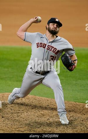Houston Astros relief pitcher Kendall Graveman talks with first baseman ...