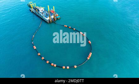 An oil boom used to contain the oil spill along the coast Stock Photo ...