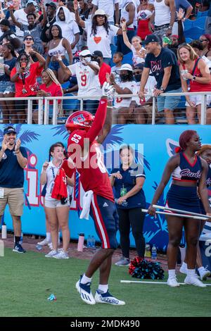 FAU wide receiver Lajohntay Wester (1) runs with ball and is tackled by ...