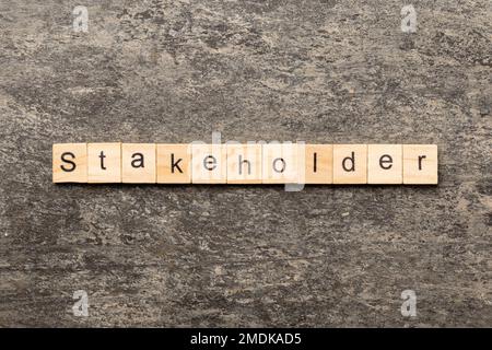 Stakeholder word written on wood block. Stakeholder text on wooden ...