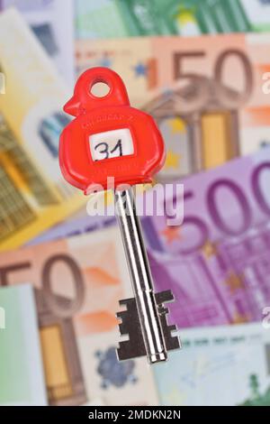 key of a safe with the number 31 on Euro bills, cutout Stock Photo - Alamy