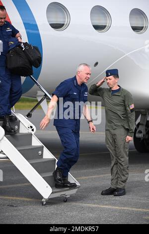 Adm. Steven D. Poulin, U.S. Coast Guard Vice Commandant, shakes hands with Capt. Nathan E ...