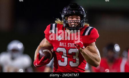 Ball State running back Carson Steele (33) leaps over Tennessee ...