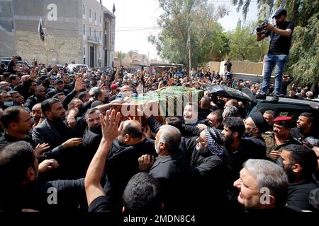 Mourners carry the coffin of Grand Ayatollah Sayyid Mohammed Saeed al ...