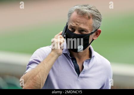 Chicago Cubs general manager Jed Hoyer talks on the phone during team's ...