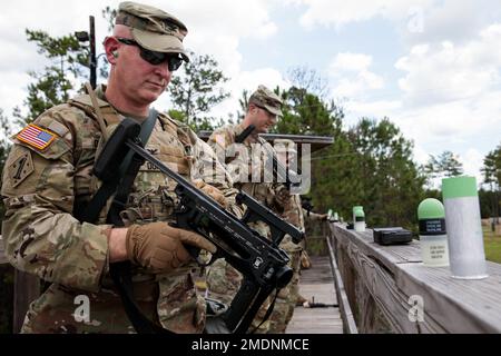 Col. John Dunn, commander of the 290th Military Police Brigade, fires ...