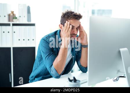 This headache isnt helping matters either. Shot of a mature businessman ...
