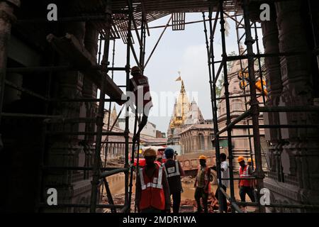 Laborers work at the under-construction Kashi Vishwanath Dham Corridor ...