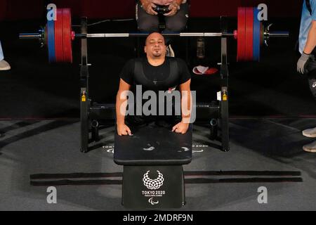 Jordan's Omar Sami Hamadeh Qarada prepares to lift during men's 49kg ...