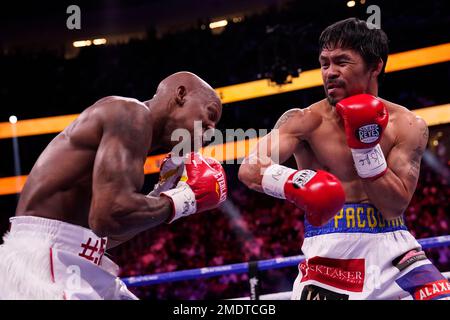 Manny Pacquiao, right, of the Philippines, and Yordenis Ugas, of Cuba ...