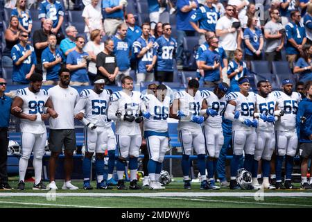 Indianapolis Colts players lock arms as the national anthem is played ...