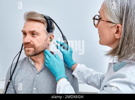 Impedance audiometry, tympanometry. Caucasian woman having a hearing ...