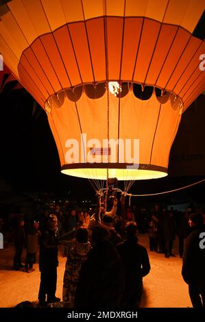 At the night of the balloons, the balloonists fire their balloons on ...