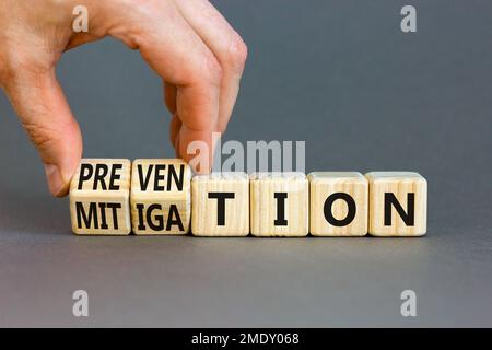 Prevention or mitigation symbol. Businessman turns cubes and changes ...