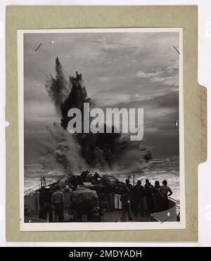 A depth charge explodes from a Coast Guard ship, demonstrating its role ...