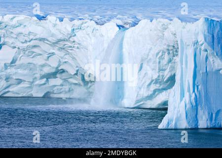 Waterfalls at edge of the Brasvellbreen glacier from the ice cap ...