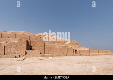 A beautiful shot of the historic Ziggurat of Chogha Zanbil under a blue ...