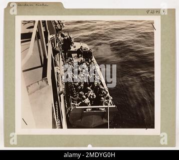 A Coast Guard-manned LST (Landing Ship Tank) discharges an Army truck ...