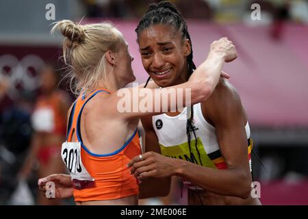 Nafissatou Thiam, of Belgium, second right, sits with Noor Vidts, of ...