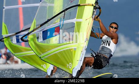 China's Bi Kun competes in the men's windsurfer medal race at the 2020 ...
