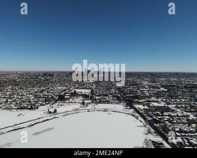 An aerial shot of the modern cityscape of Denver under the blue cloudy ...