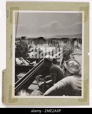 A Coast Guard-manned LST (Landing Ship Tank) serves as a temporary ...