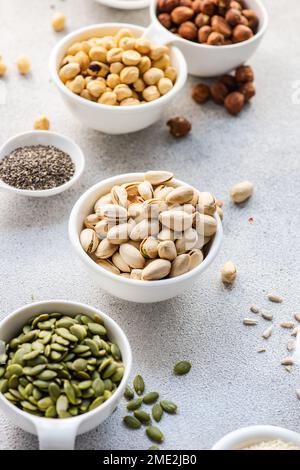 Composition with bowls of flax seeds on color background Stock Photo ...