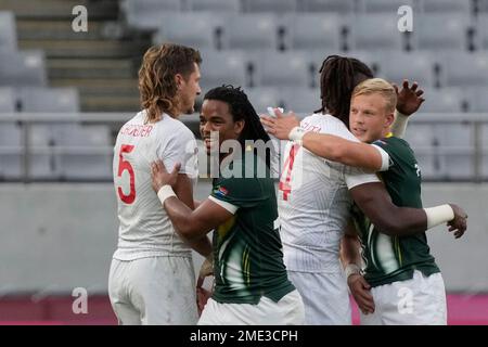 South Africa's JC Pretorius, left, is tackled by Fiji's Meli Derenalagi ...
