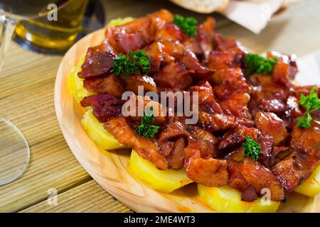 Morro de cerdo a la gallega - spanish dish. Roast nose and cheek pigs ...