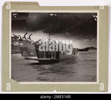 This image captures a Coast Guard landing craft personnel (LCP) ablaze ...