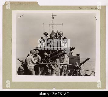 This image shows Coast Guardsmen aboard an LCI (Landing Craft Infantry ...