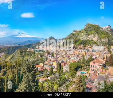 Awesome view of Taormina resorts and Etna volcano mount. Giardini-Naxos ...